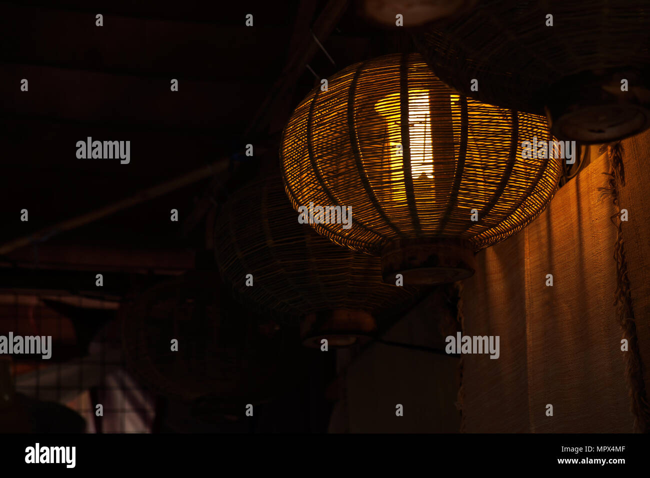 View of native lantern, made of wicker. Dark tone Stock Photo - Alamy