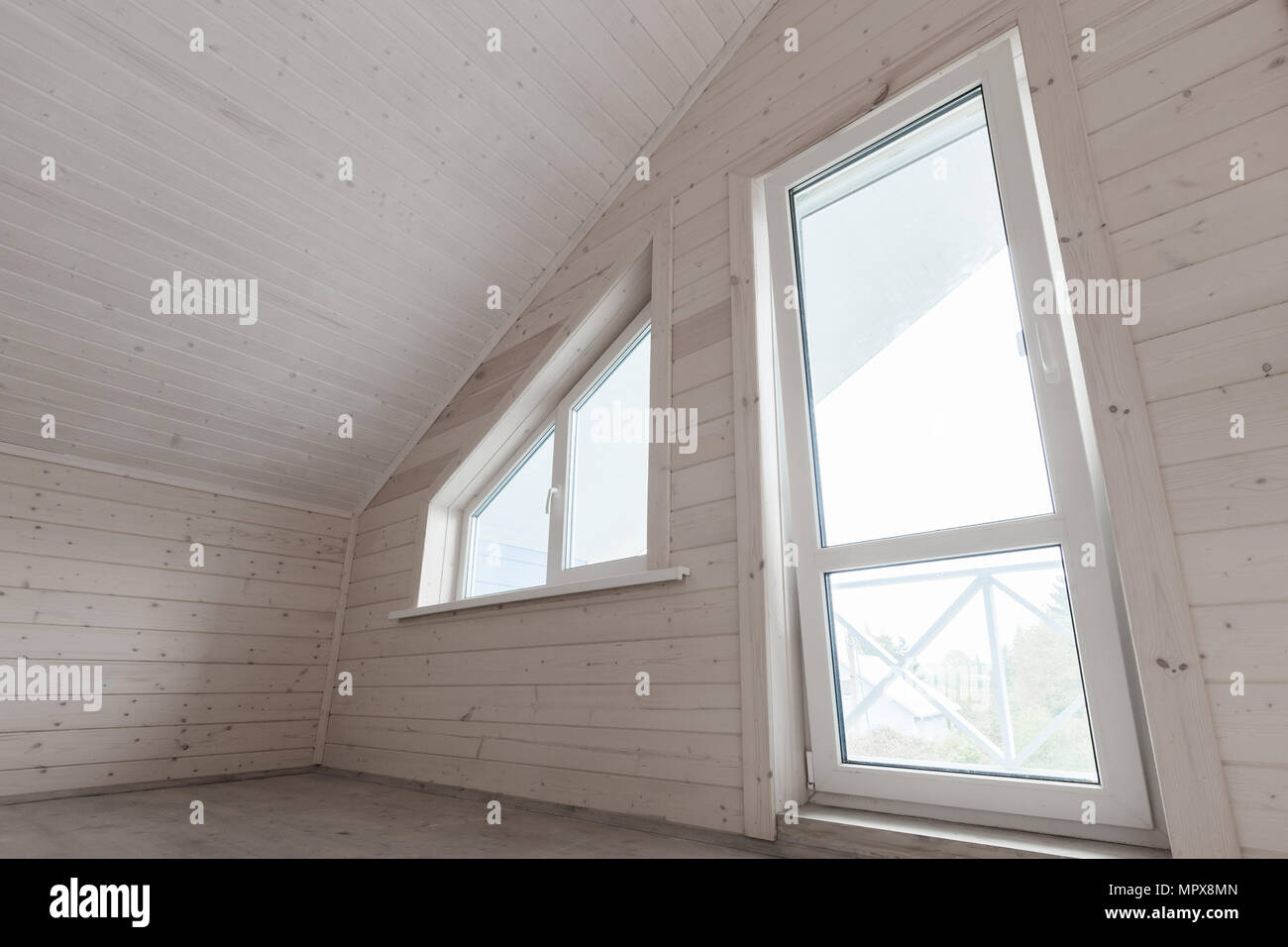 Empty white new wooden house interior, attic room with window and ...
