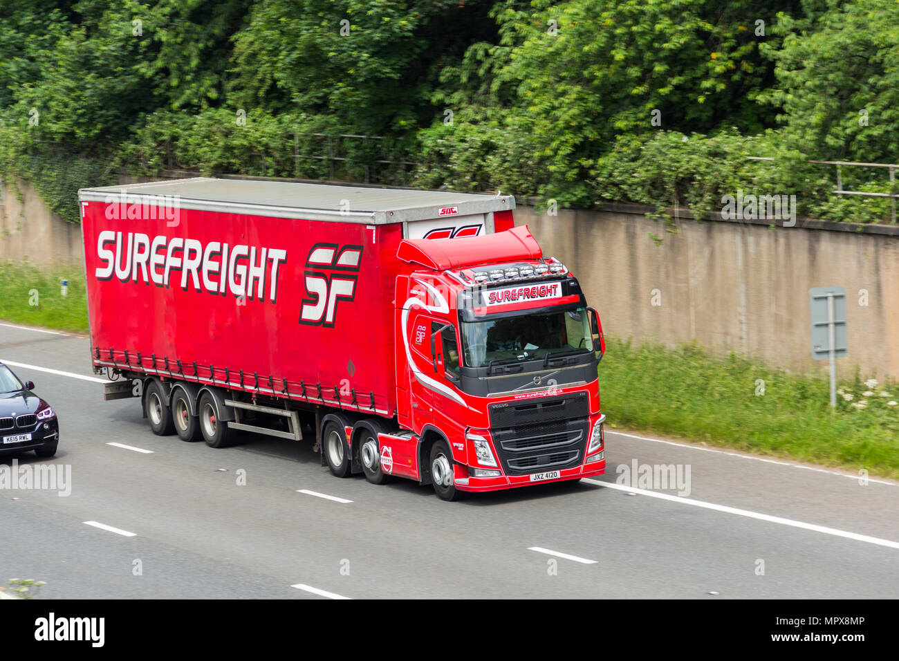 Surefreight branded Volvo FH460 tractor unit with a curtain sided ...