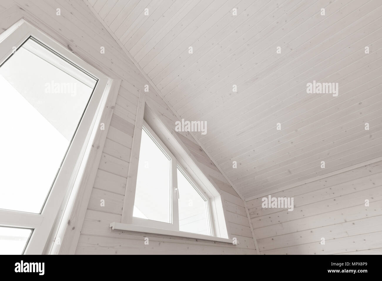 Empty new wooden house interior fragment, white attic room with window ...
