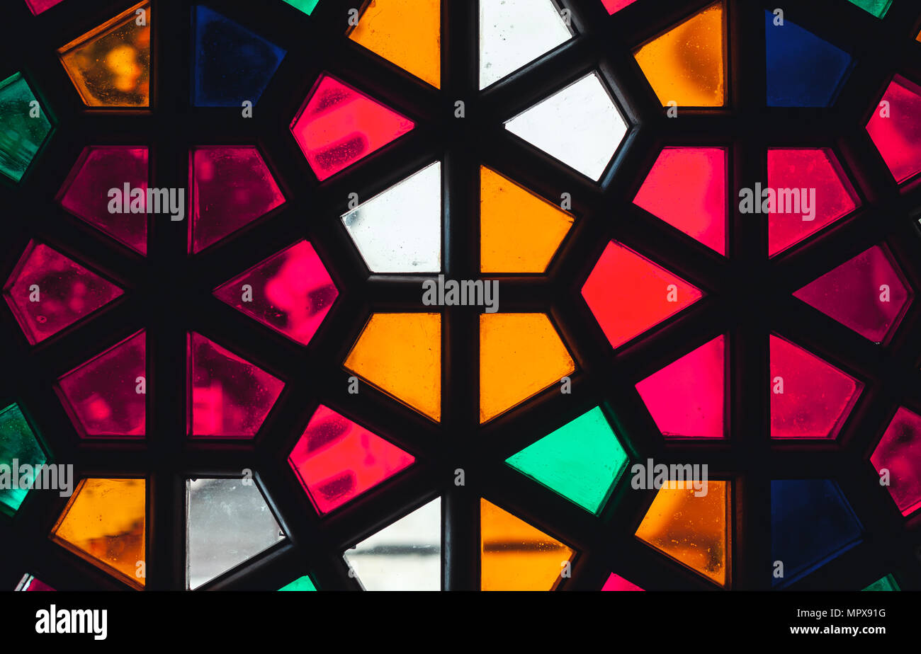 Stained glass window with geometric Arabic pattern, background texture ...