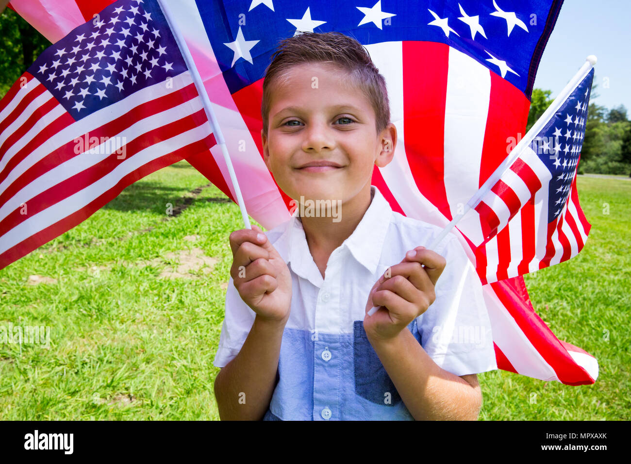 Boy holding american flag hi-res stock photography and images - Alamy