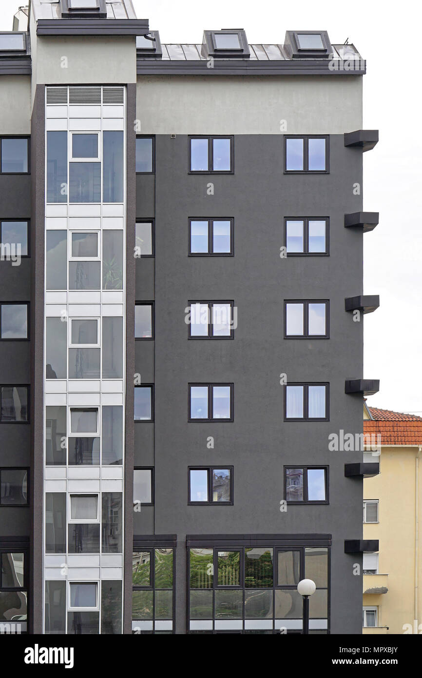 New condo building with gray exterior Stock Photo - Alamy