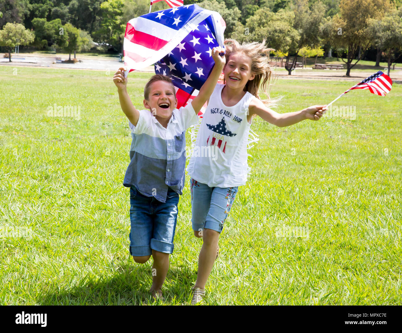 Children holding american flag in hi-res stock photography and images ...