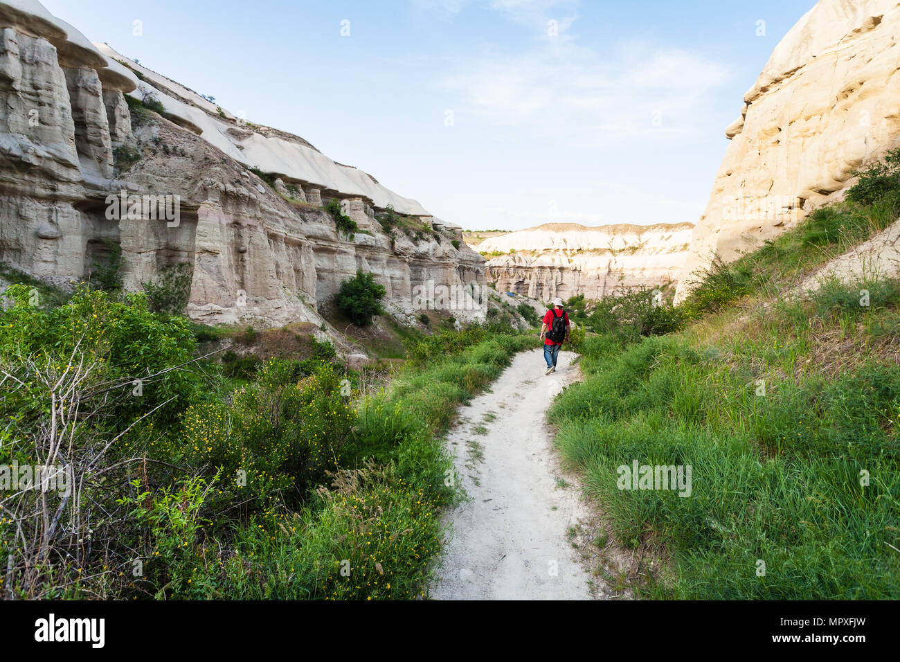 Travel to Turkey - tourist walks along pathway near Goreme town in ...