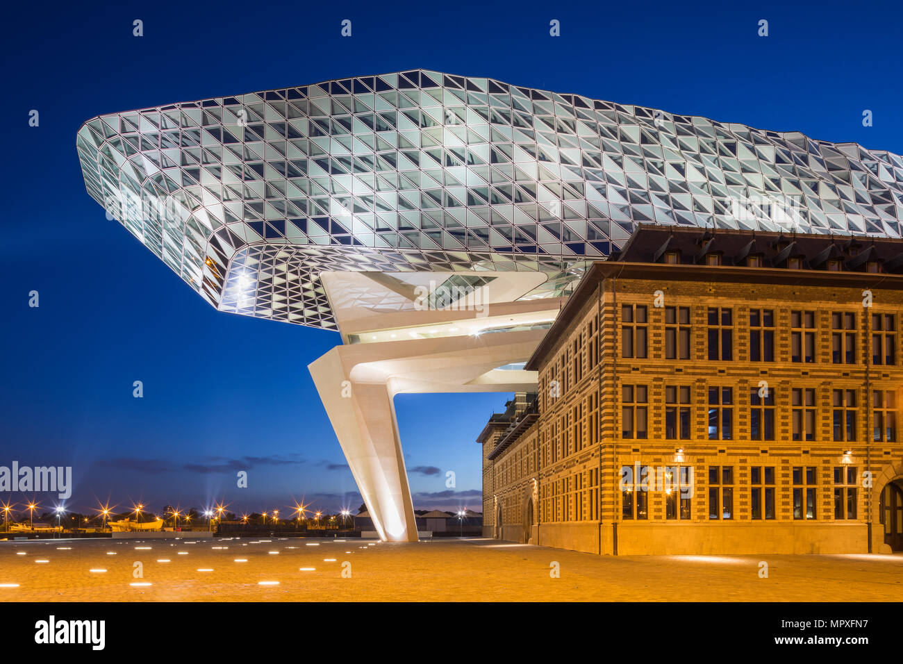 Zaha Hadid Architects, the new Port House during twilight in Antwerp ...