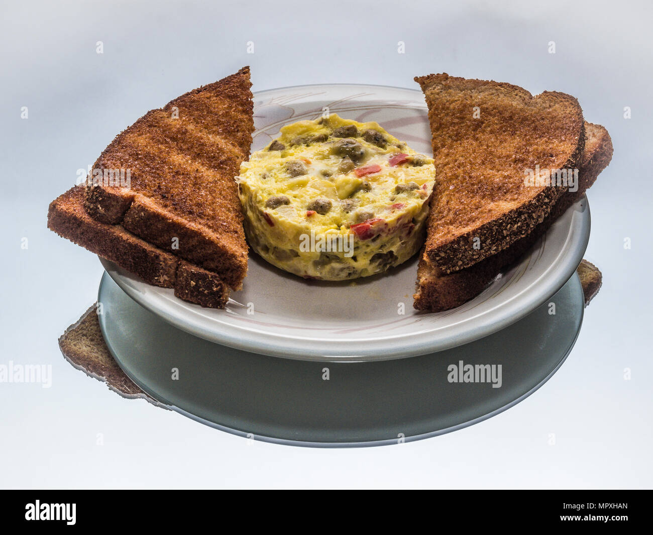 scrambled eggs and wheat toast breakfast on mirror Stock Photo - Alamy
