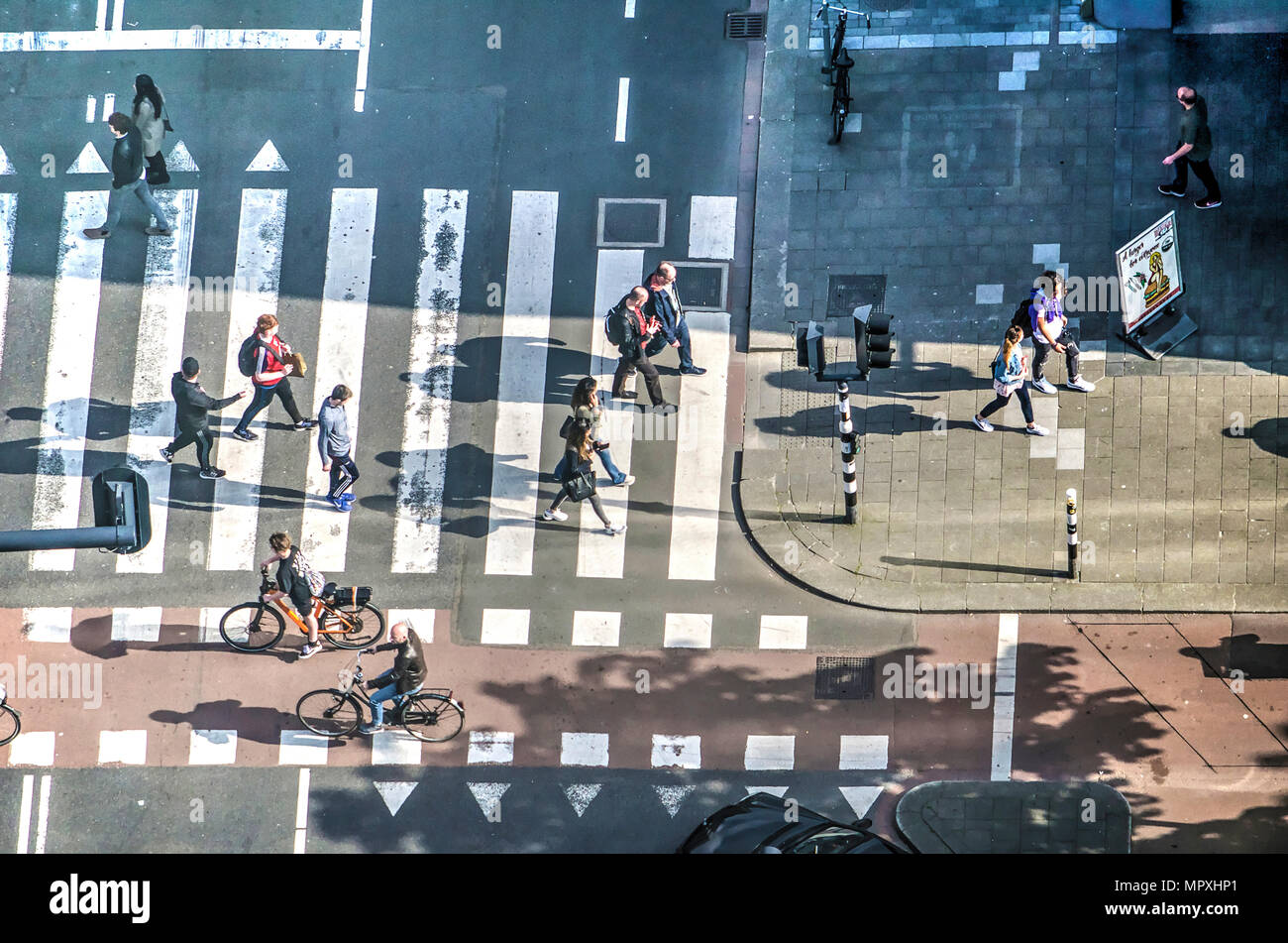 Rotterdam, The Netherlands, May 11, 2018: pedestrians and cyclists ...