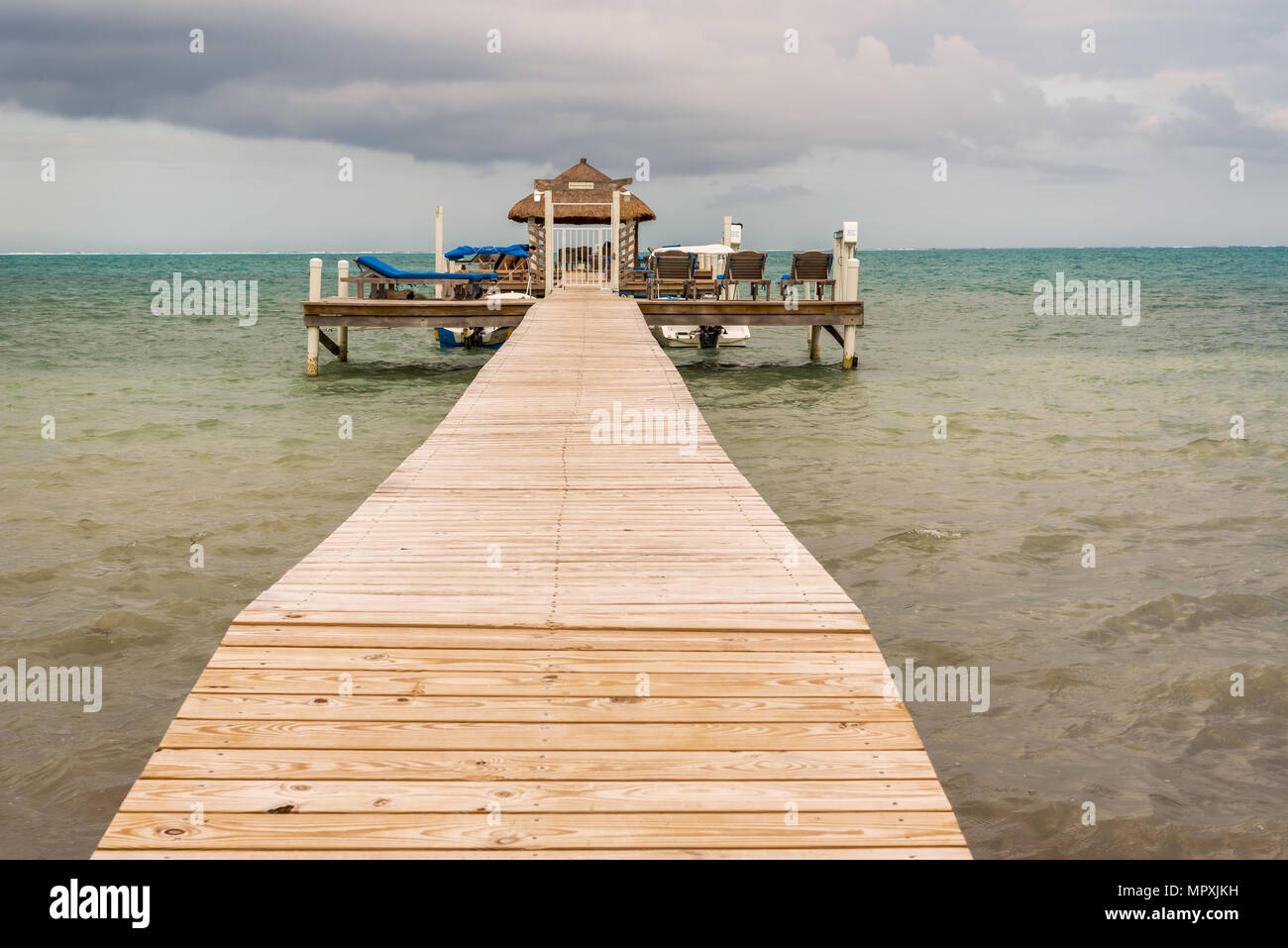 Wooden pier dock and picturesque, relaxing ocean view at Caye caulker ...
