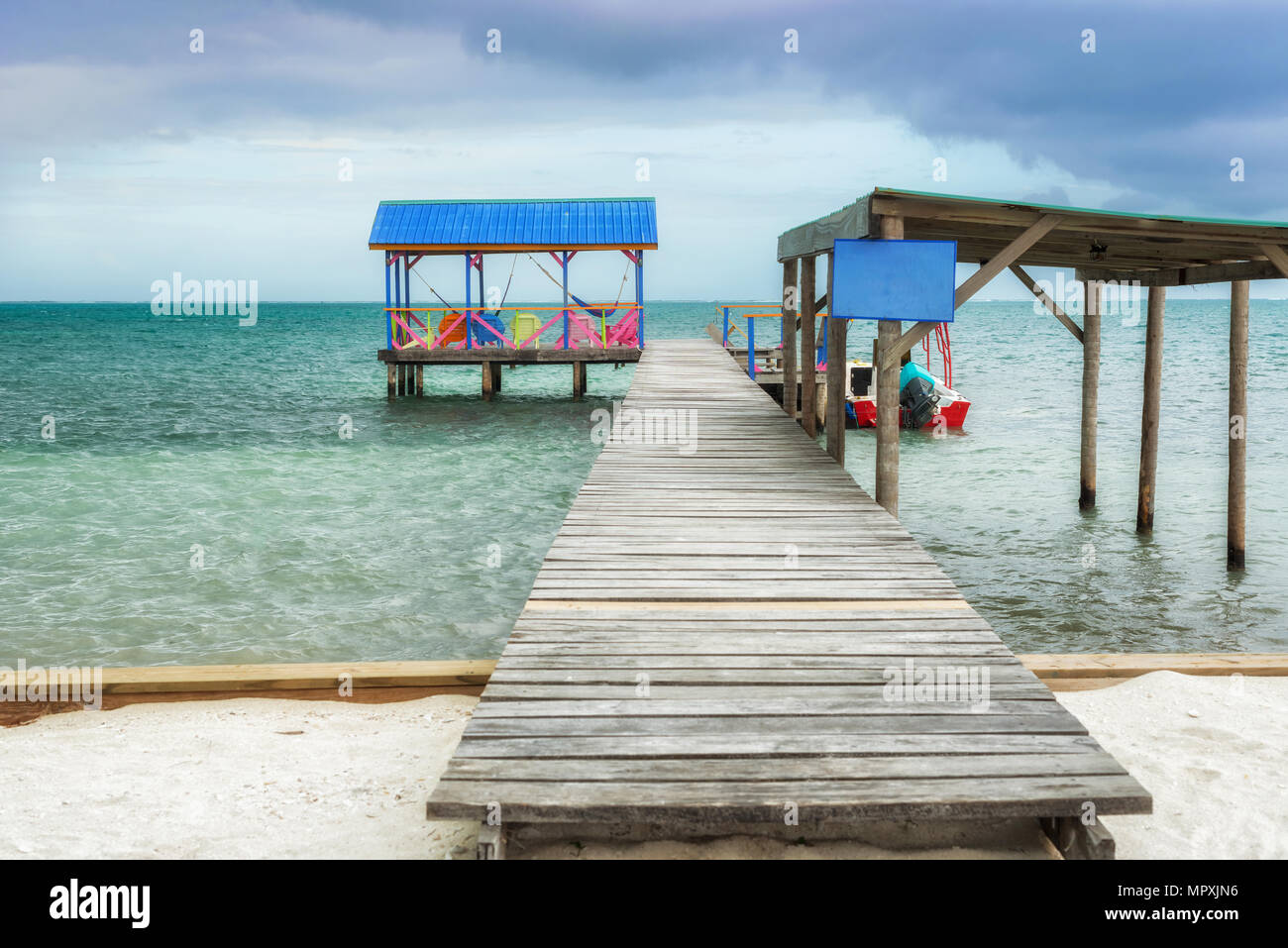 Wooden pier dock and picturesque, relaxing ocean view at Caye caulker ...