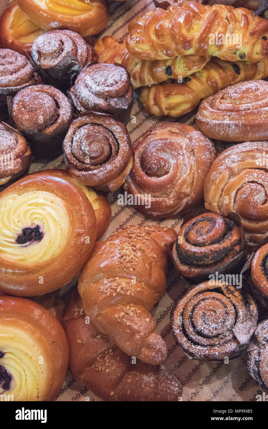 A selection of pastries and sugar you cakes for sale at an artisan ...