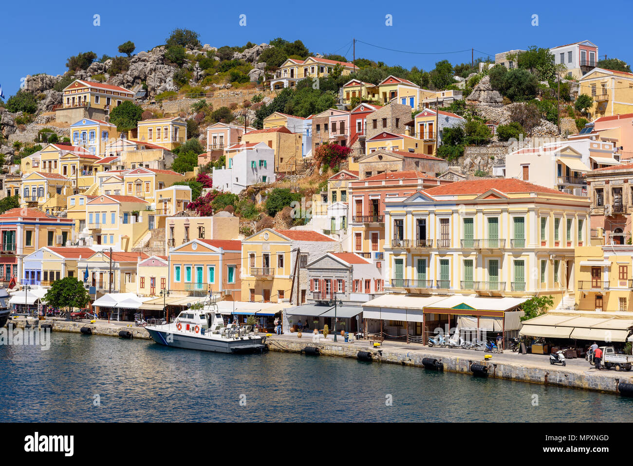 Colorful houses on the hillside of the island of symi. Greece Stock ...