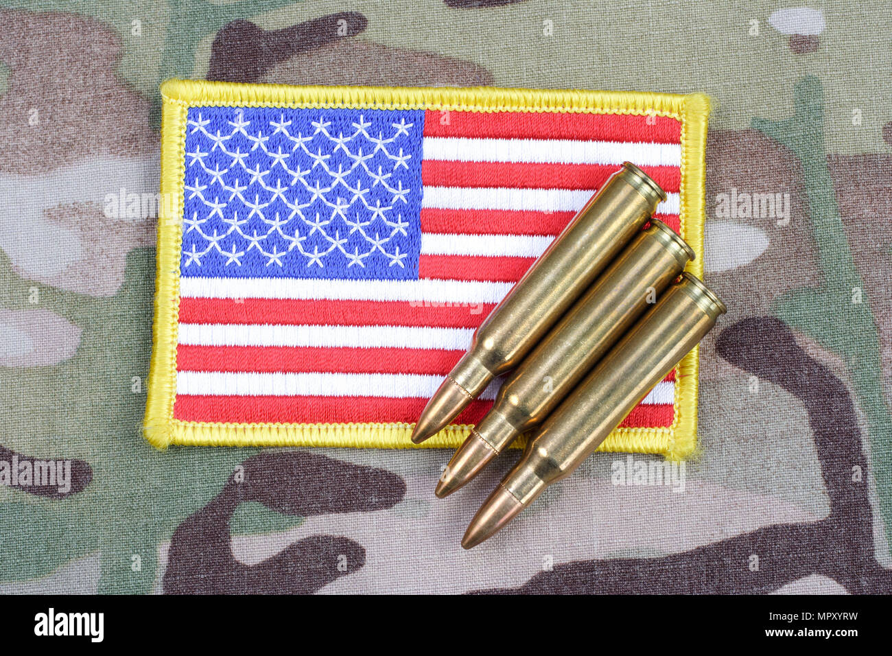 ARMY flag patch and 5.56 mm rounds on camouflage uniform Stock Photo ...
