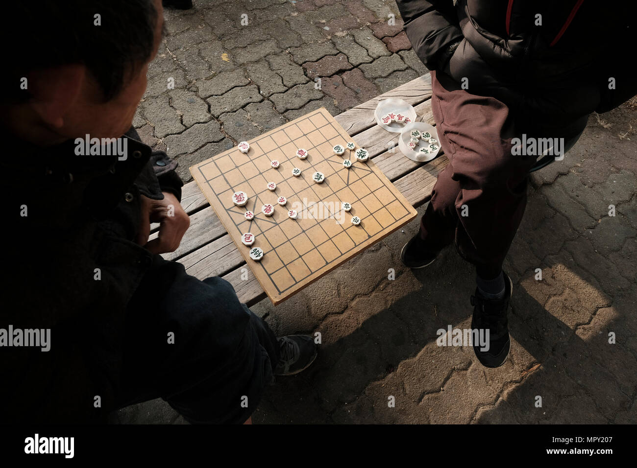 Korean men playing a strategy board game called Janggi changgi or ...