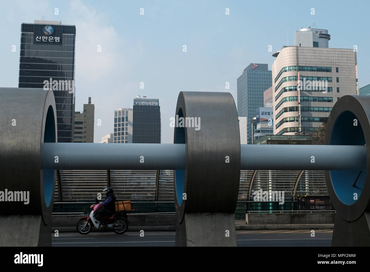 A motorcyclist rides a scooter in the city of Seoul South Korea Stock ...
