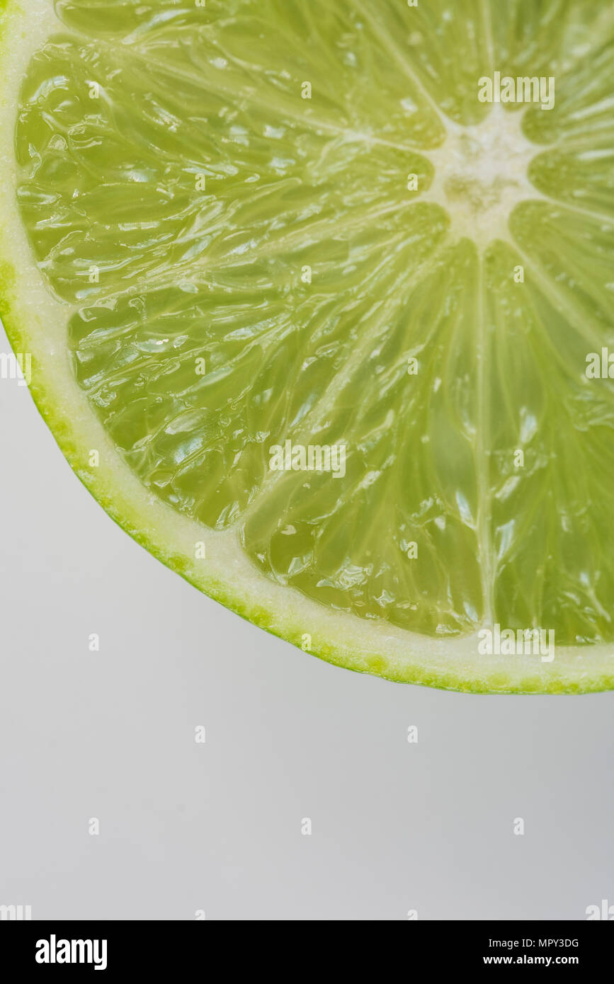 Close-up of lime slice on white background Stock Photo - Alamy