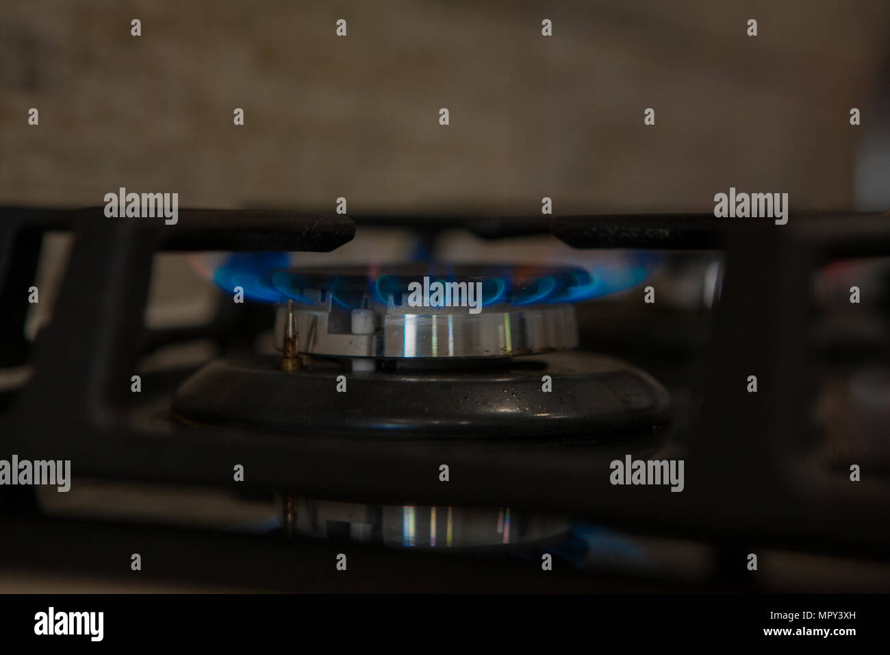 Burning blue gas on the dark stove. Burner gas stove, concept of energy ...