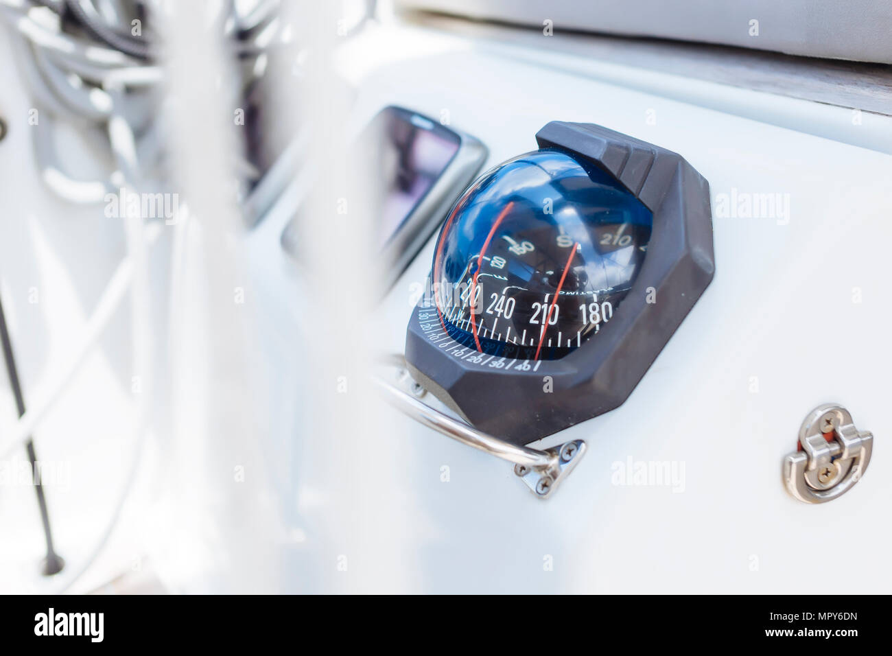 High angle view of marine compass on sailing ship Stock Photo - Alamy