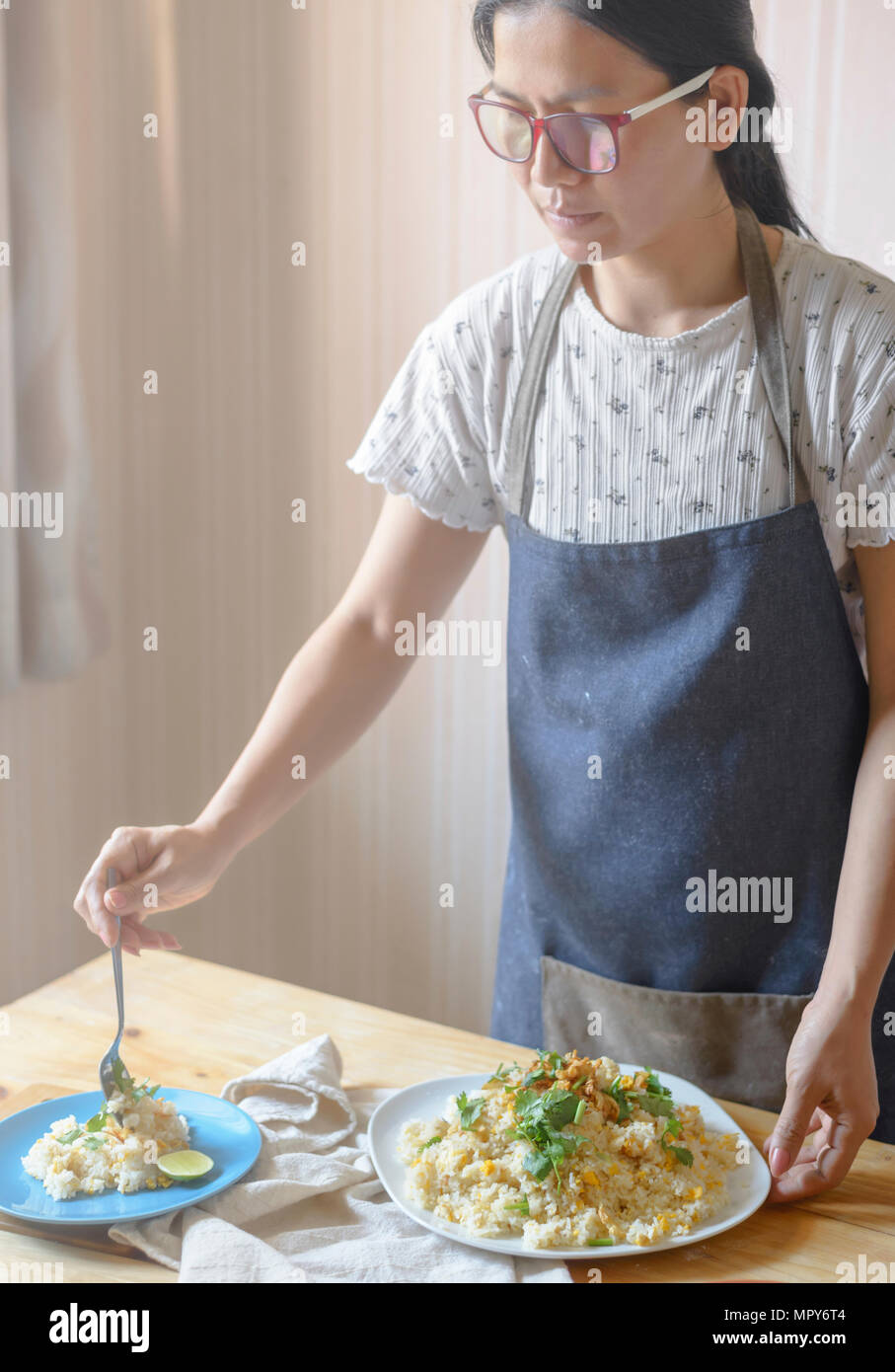 Woman in apron standing on hi-res stock photography and images - Alamy
