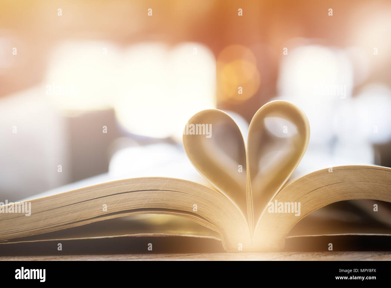 Open book heart pages flower hi-res stock photography and images - Alamy