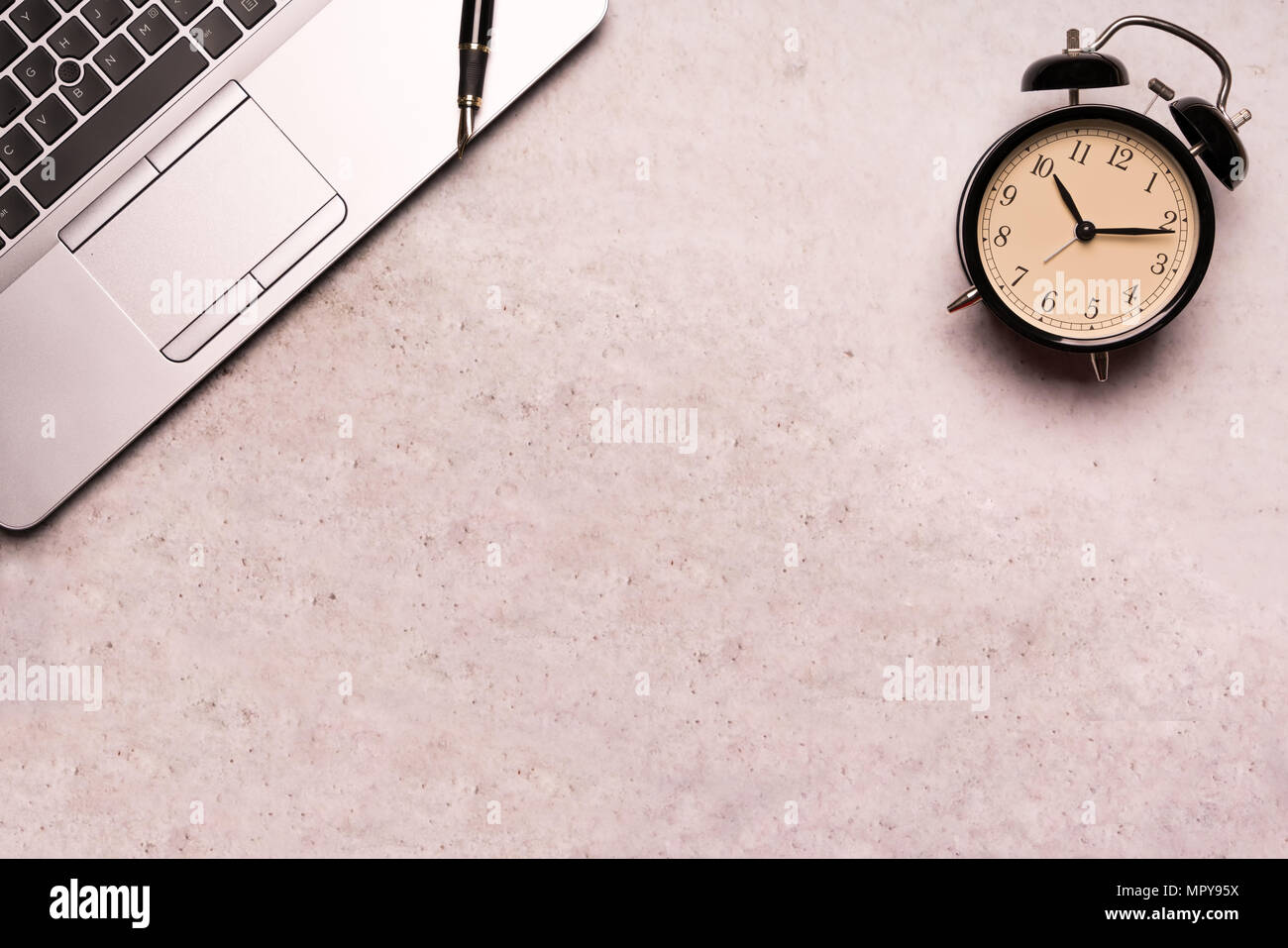 computer laptop with black clock on working table flat lay composition ...