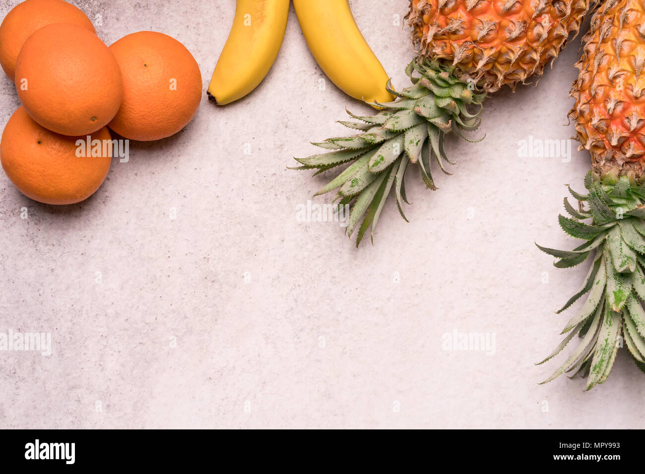 Tropical and Seasonal Summer Fruits. Pineapple Oranges and Bananas ...