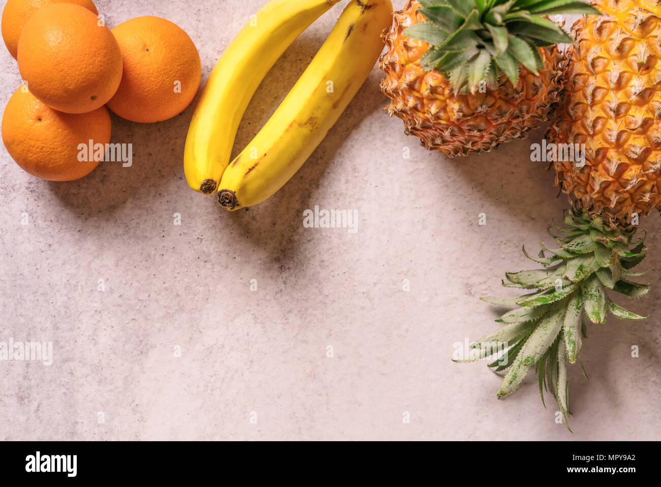 Tropical and Seasonal Summer Fruits. Pineapple Oranges and Bananas ...