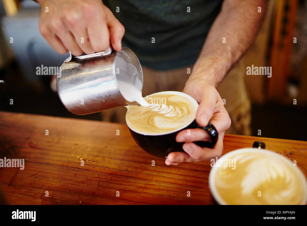Barista making art latte hi-res stock photography and images - Alamy