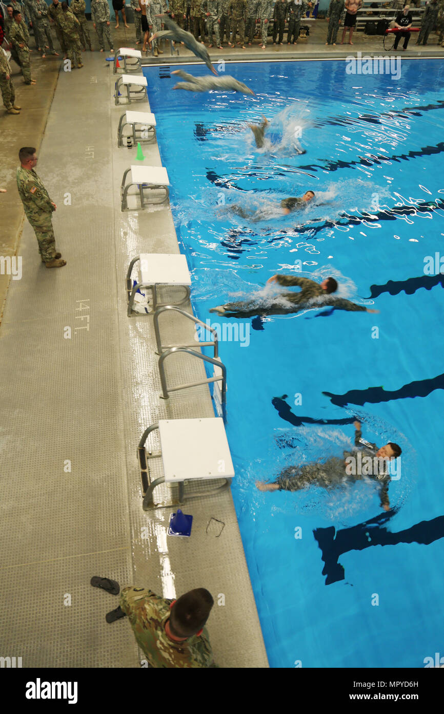 U.S. Soldiers with the 20th CBRNE Command, commence the 100 meter swim ...