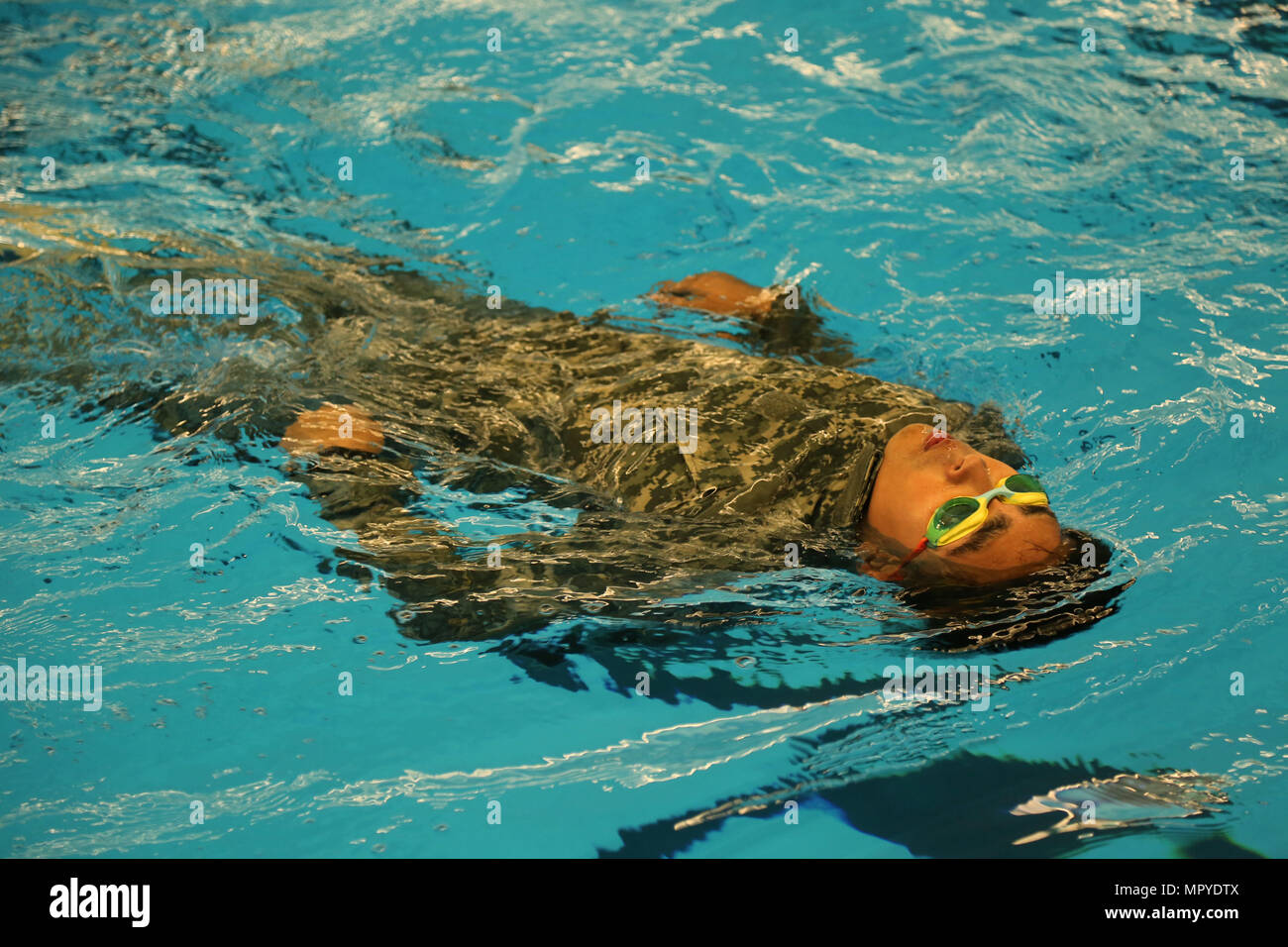 A U.S. Soldier with the 20th CBRNE Command, controls his breathing ...