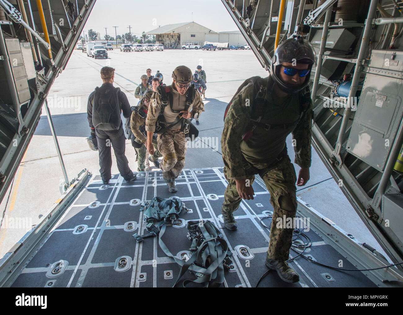 U. S. Navy Sailors assigned to Explosive Ordnance Disposal Group One ...