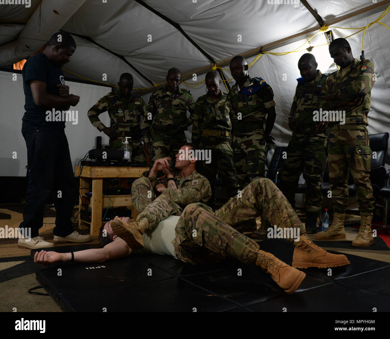 Members of the Forces Armées Nigeriennes watch as Senior Airman Joshua ...