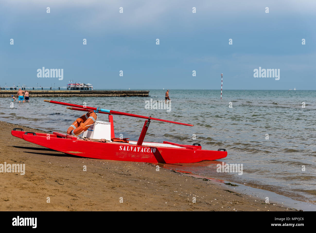 Red boat on the beach Stock Photo - Alamy