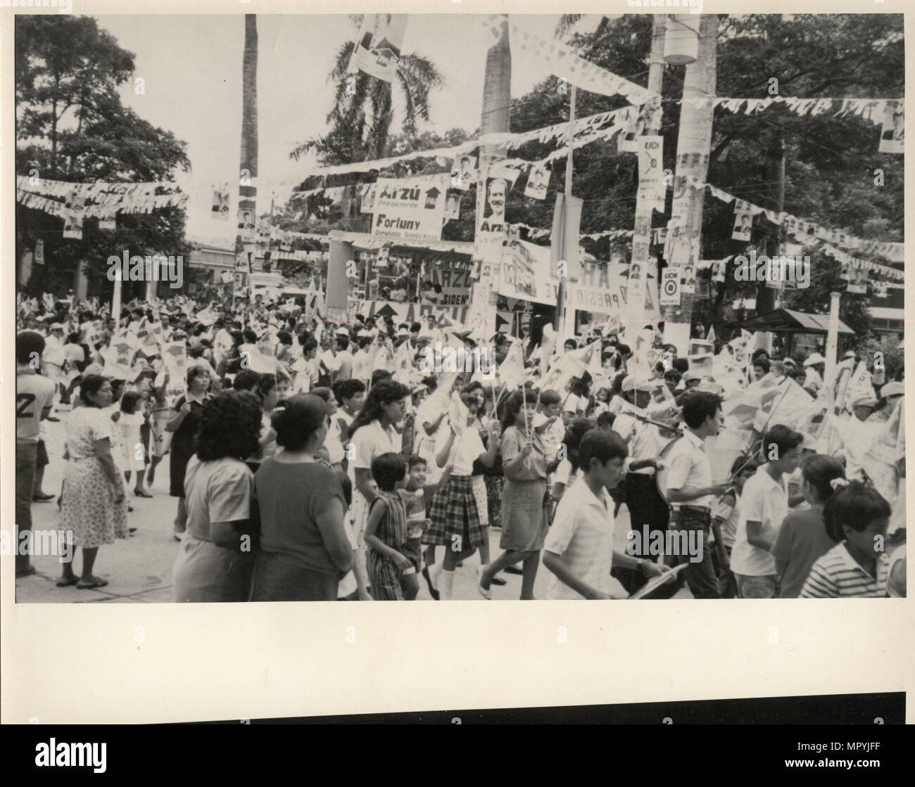 men and women walking through town Stock Photo - Alamy