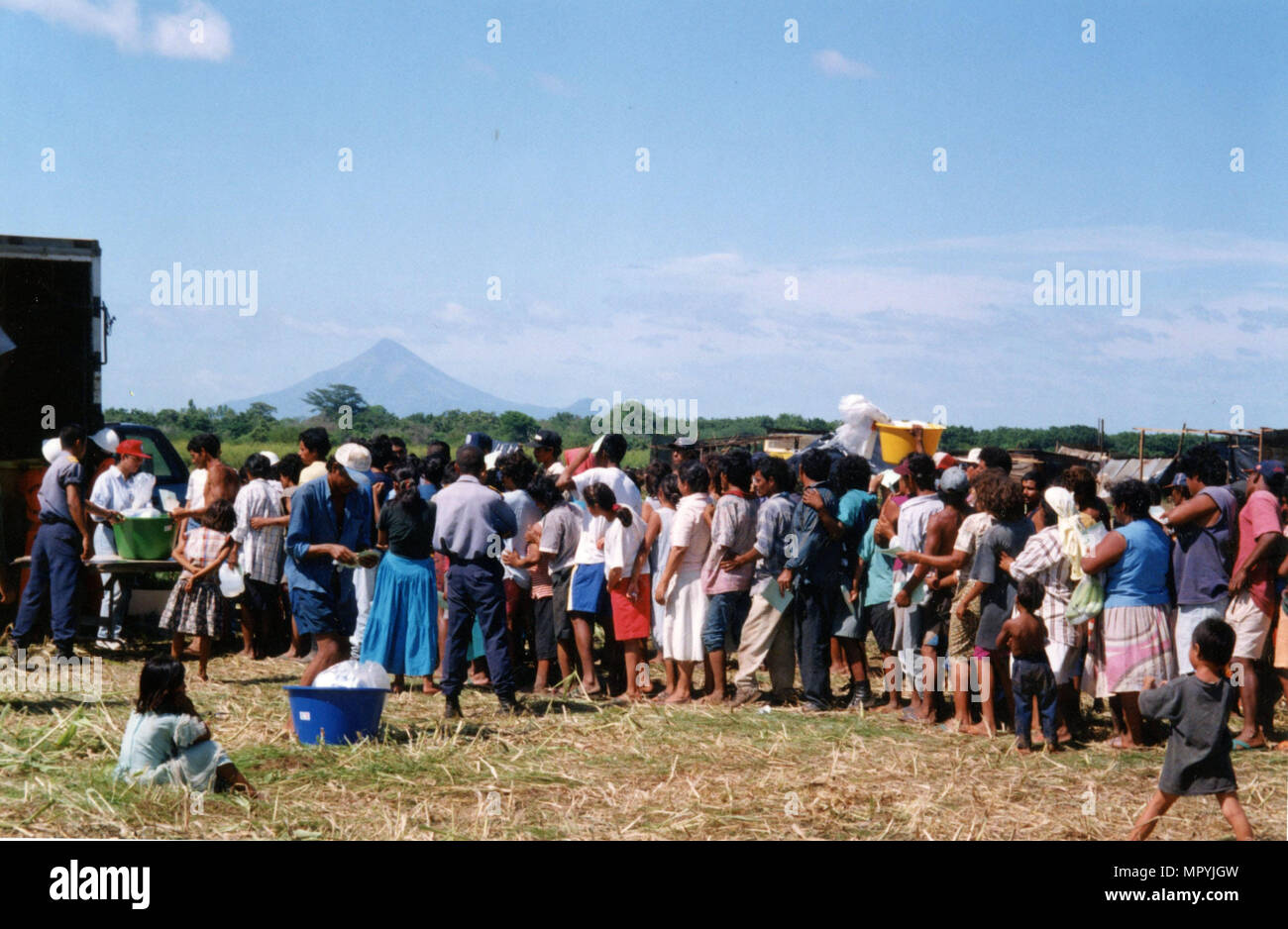 men and women getting food Stock Photo - Alamy