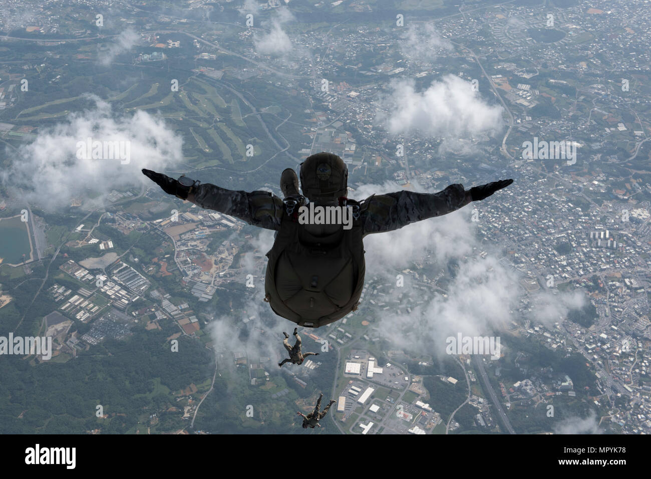 U.S. Air Force Airmen and U.S. Army Soldiers perform a high altitude ...