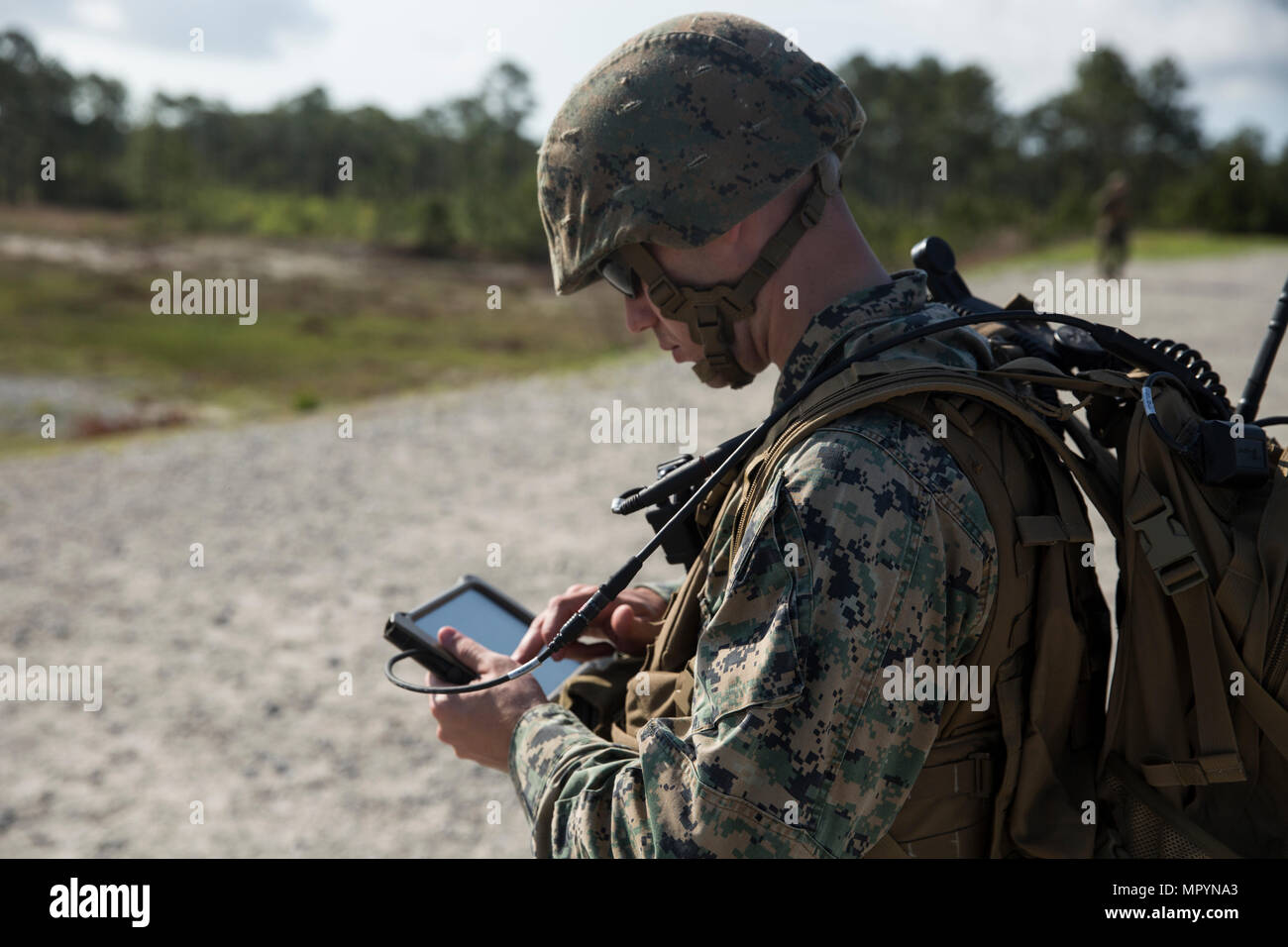 A Marine looks at a digital map on a Target Handoff System v2.0 during ...