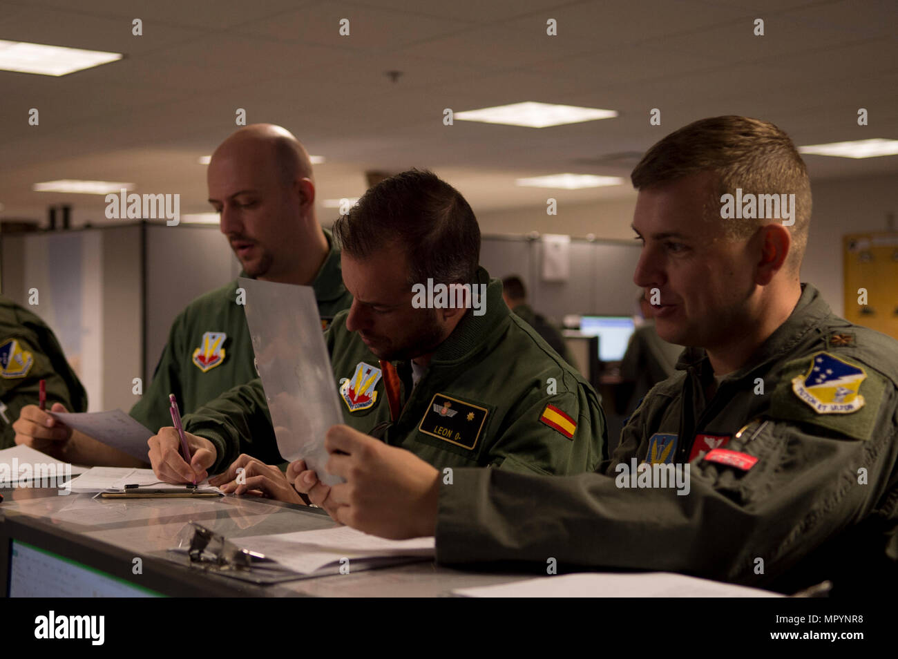 Maj. Aaron, a 29th Attack Squadron MQ-9 Reaper instructor pilot, right ...