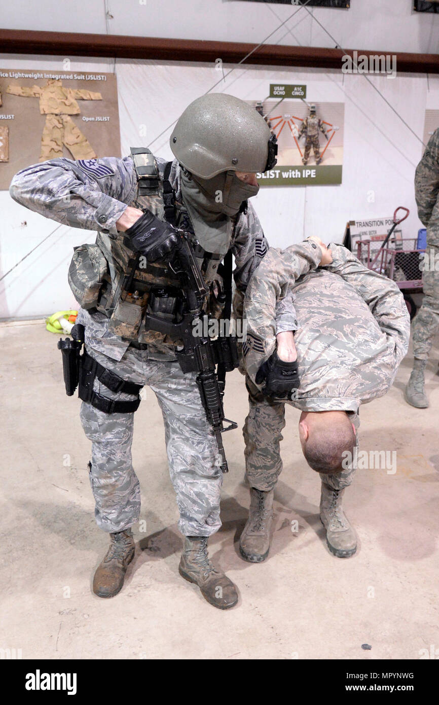 Tech. Sgt. Kenneth Willingham, 75th Security Forces Squadron, detains a ...