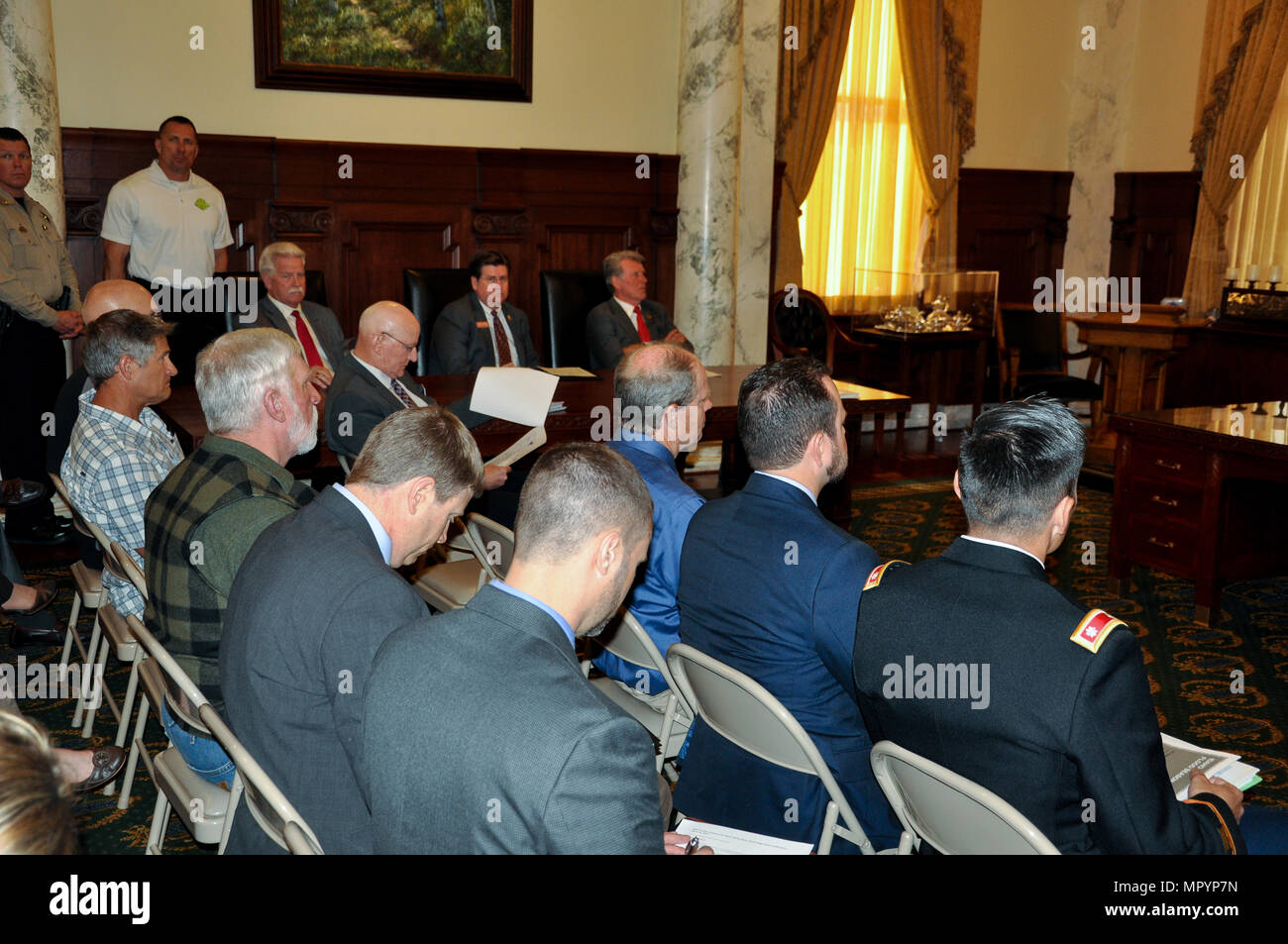 A dozen federal and state officials looked on as Lt. Col. Damon ...