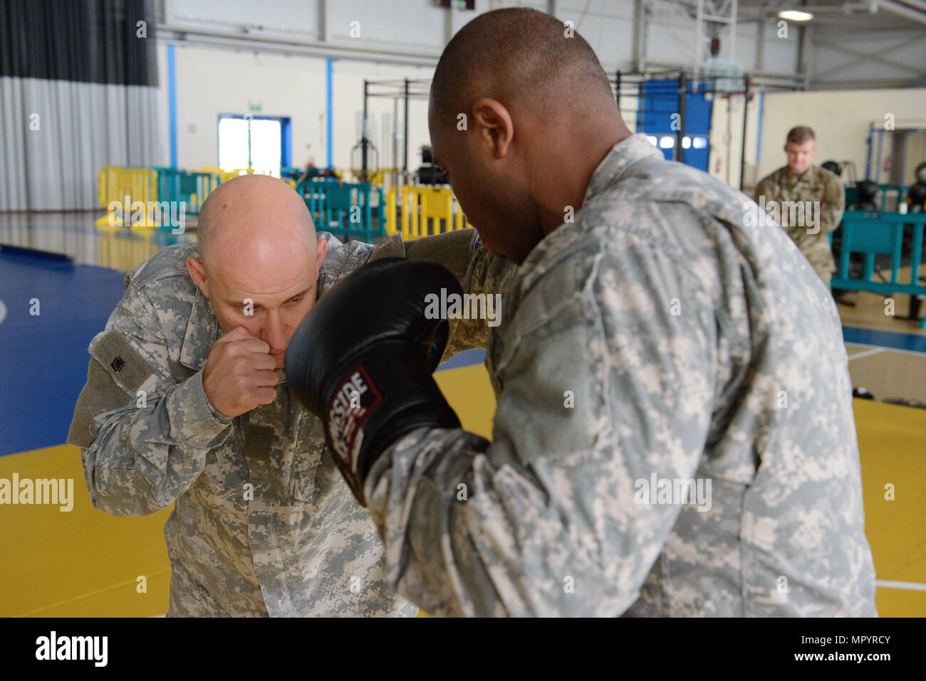 U.S. Army Sgt. 1st Class Philip Bleinberger, left, with the Supreme ...