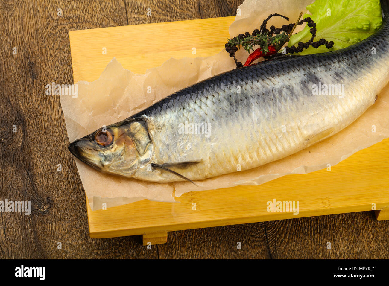 Salted Herring fish with pepper and spices Stock Photo - Alamy