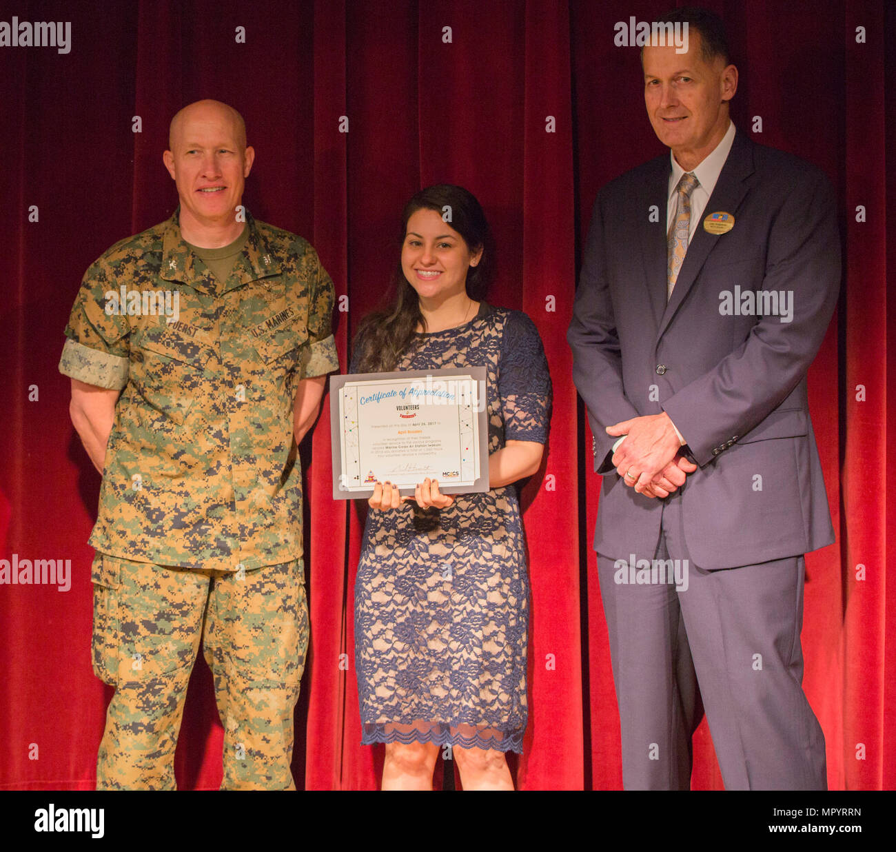 April Rosales, center, a volunteer with the Navy-Marine Corps Relief ...
