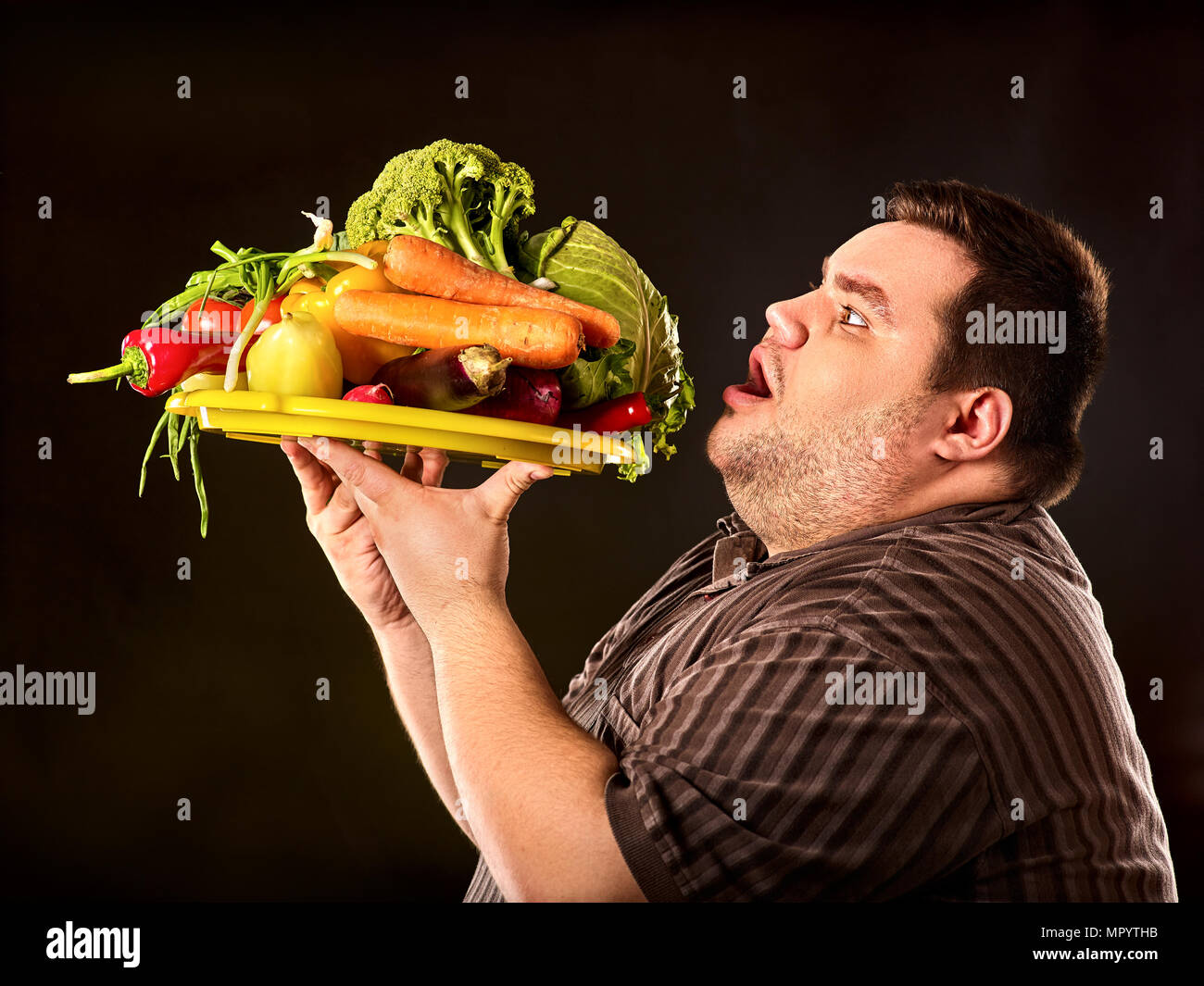 Diet fat man eating healthy food. Healthy breakfast with vegetables ...