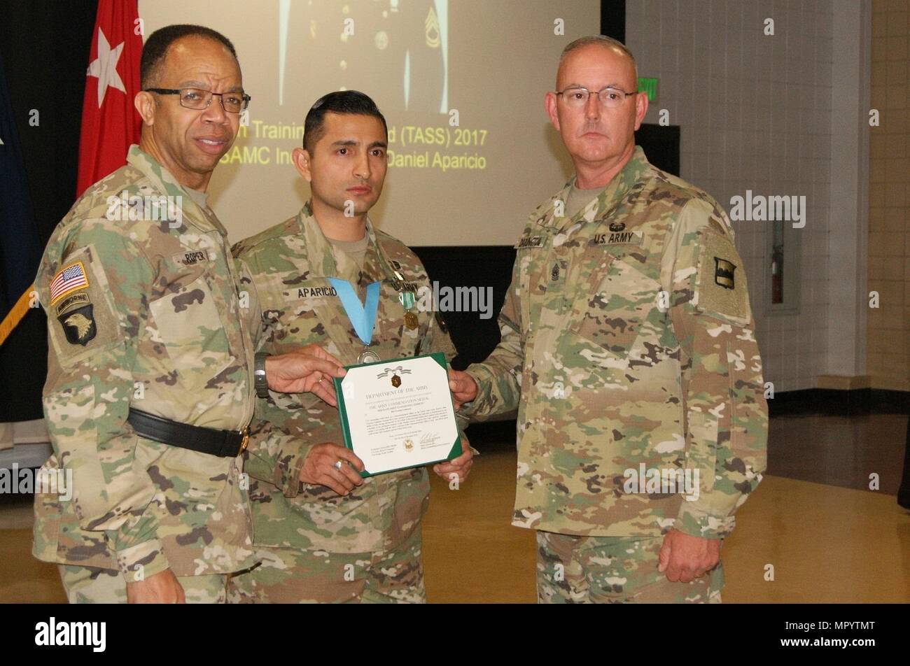 Sgt. 1st Class Daniel Aparicio (center) receives the Sgt. Audie Murphy ...
