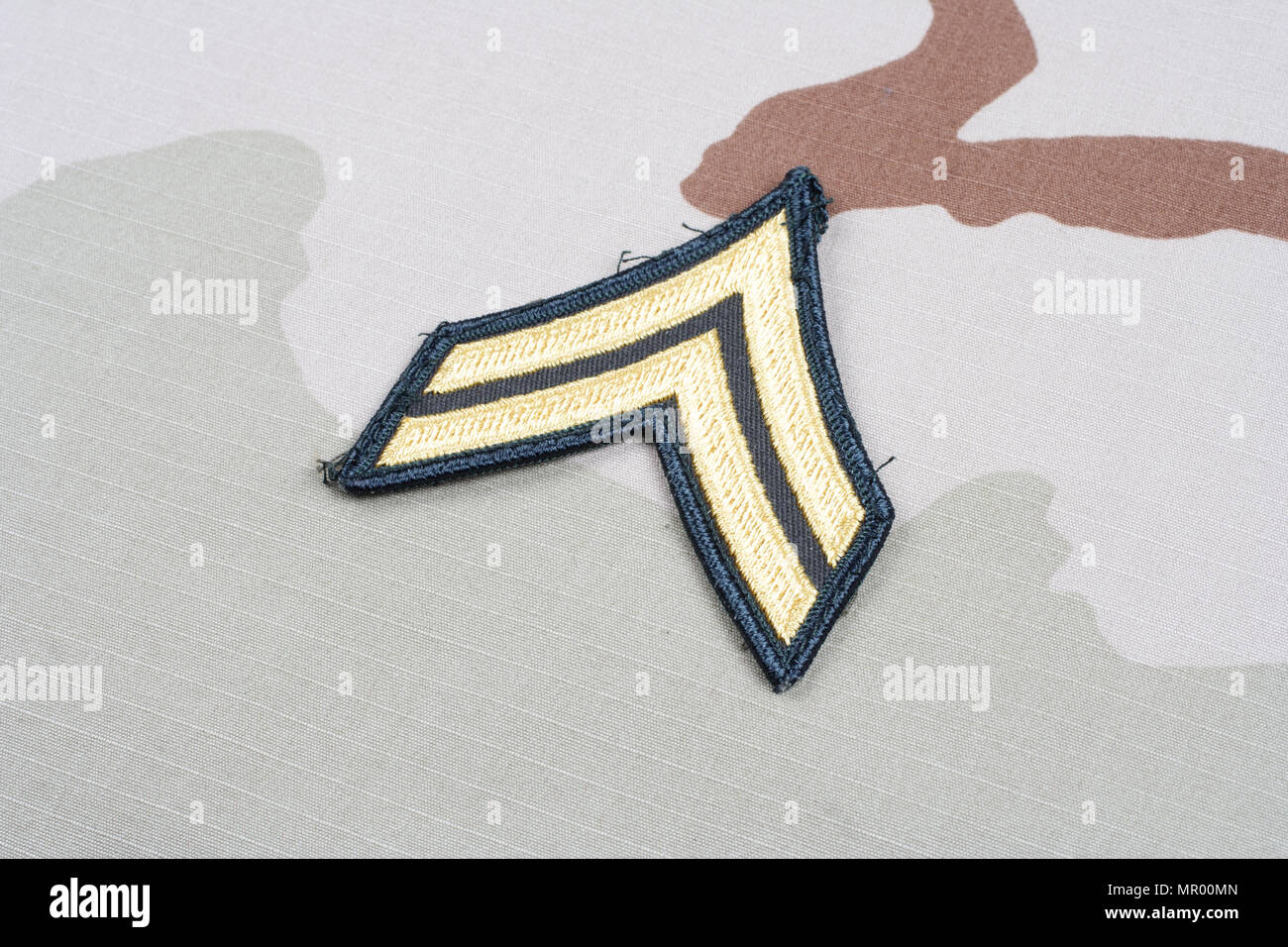 KIEV, UKRAINE - May 18, 2015. US ARMY Corporal rank patch on desert ...