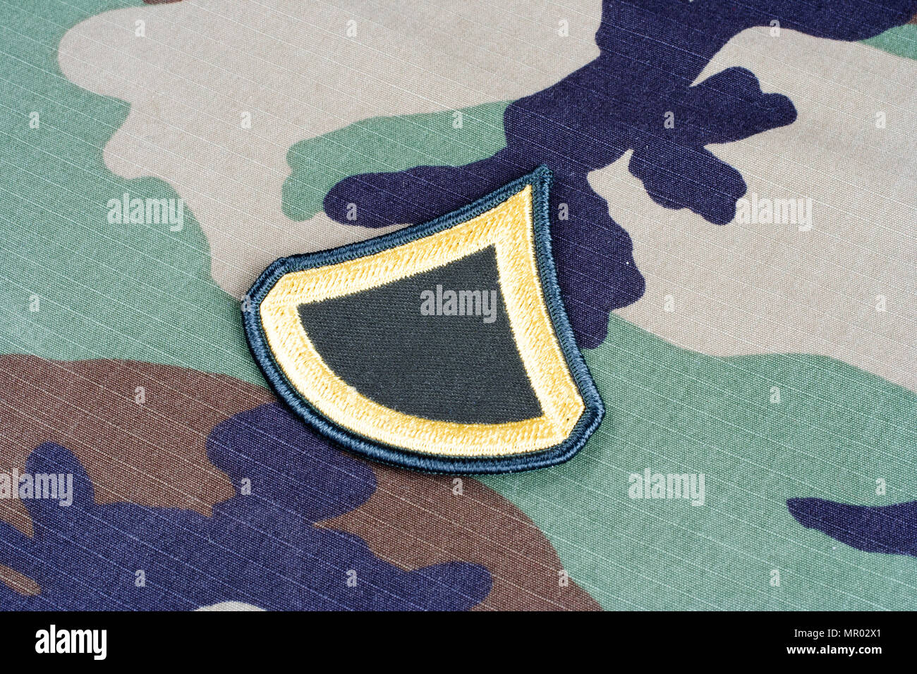 KIEV, UKRAINE - June 6, 2015. US ARMY Private First Class rank patch on woodland camouflage ...
