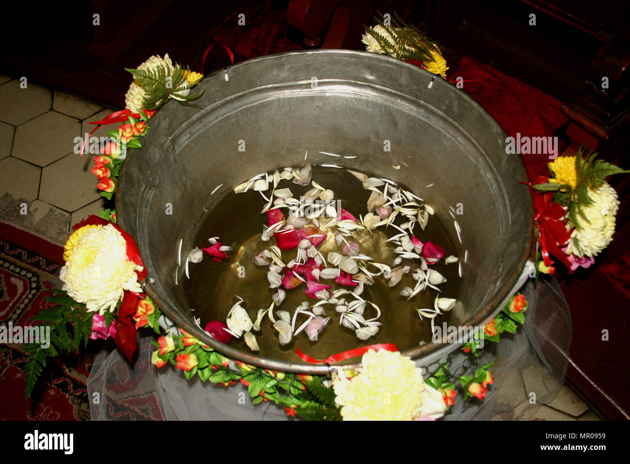 Large cauldron filled with water for baby baptism in Eastern Orthodox ...