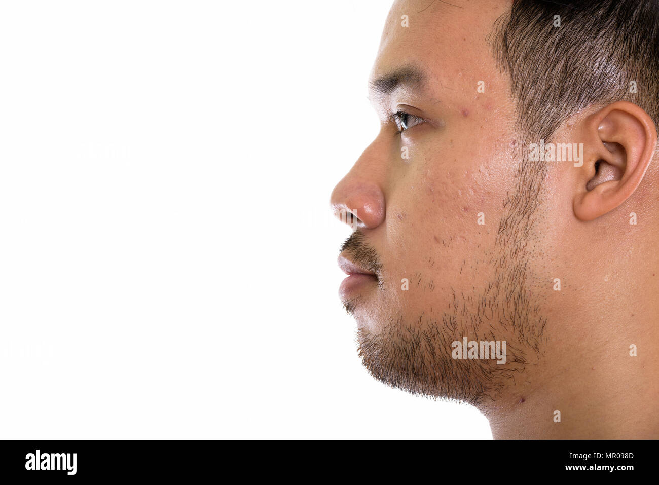Close up profile view of young Asian man Stock Photo - Alamy