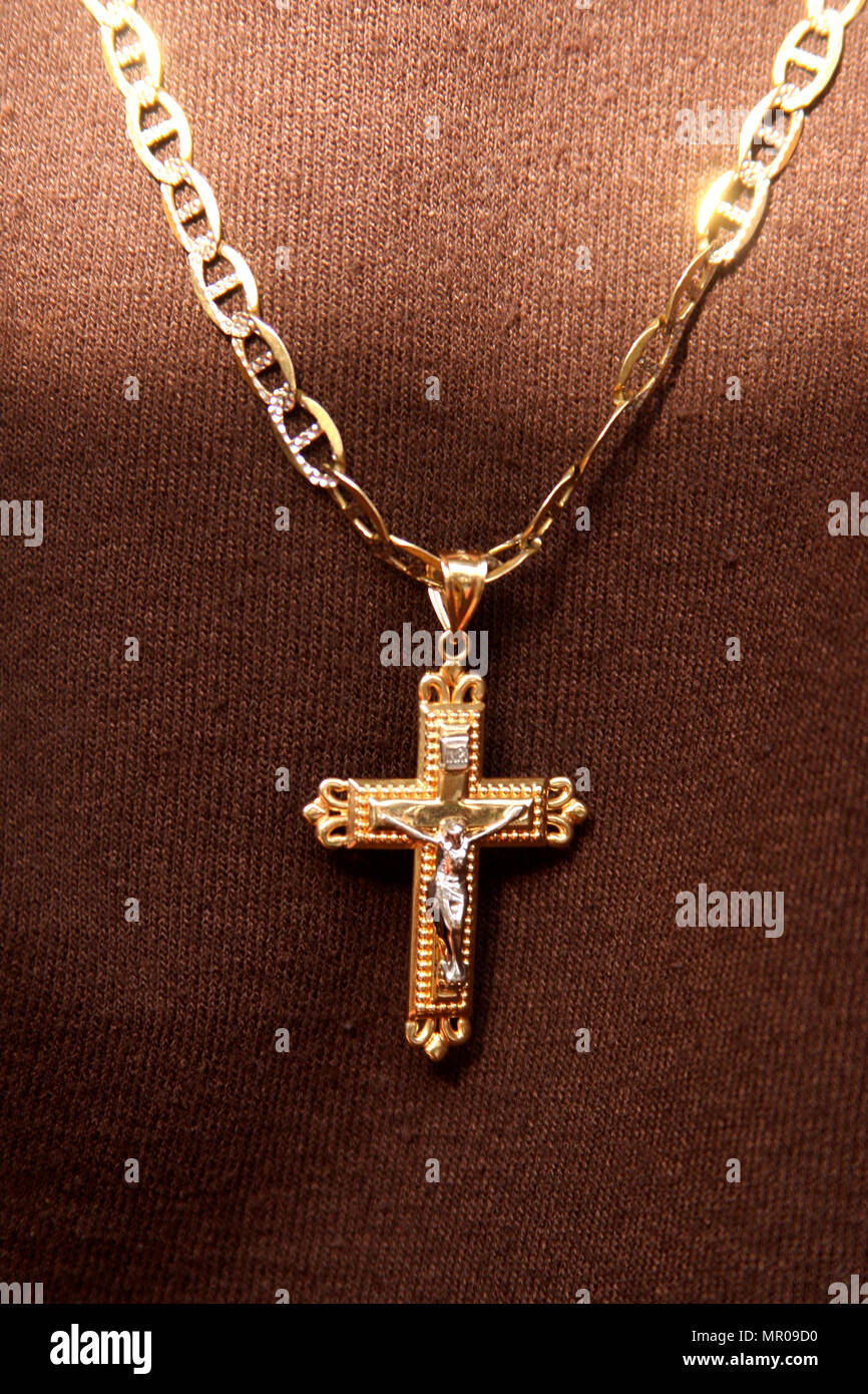 Close up of crucifix worn by man as symbol of his faith Stock Photo - Alamy